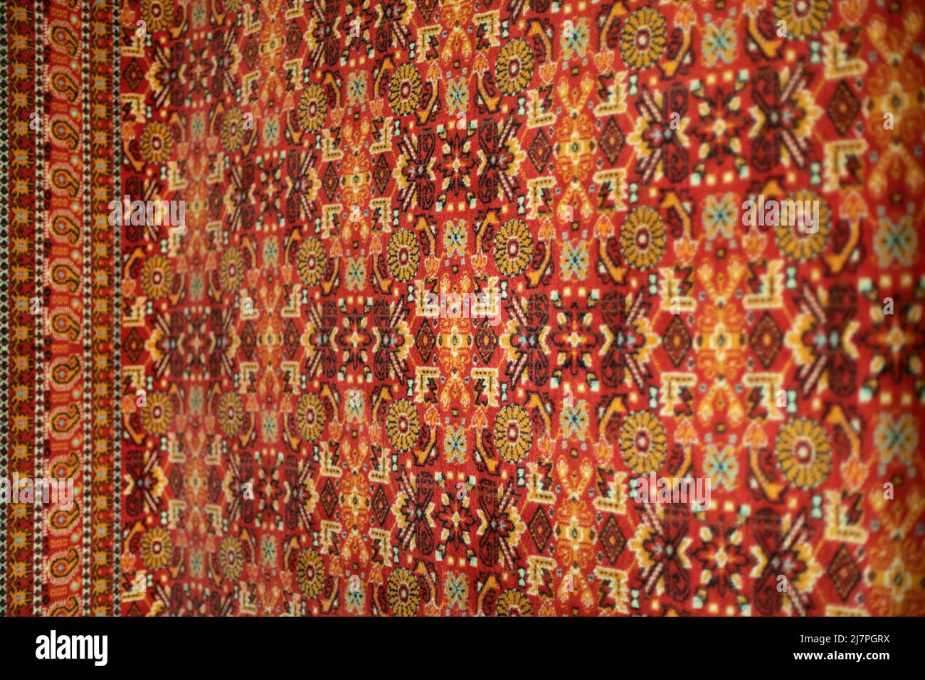 Red carpet in Russia. Fabric with pattern. Traditional carpet on wall ...