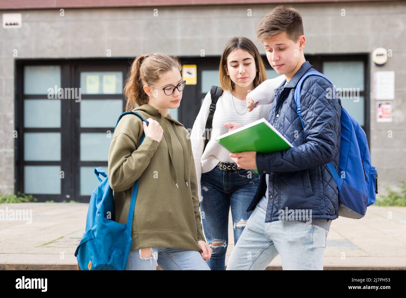 Teenage students talking outside between lessons Stock Photo - Alamy