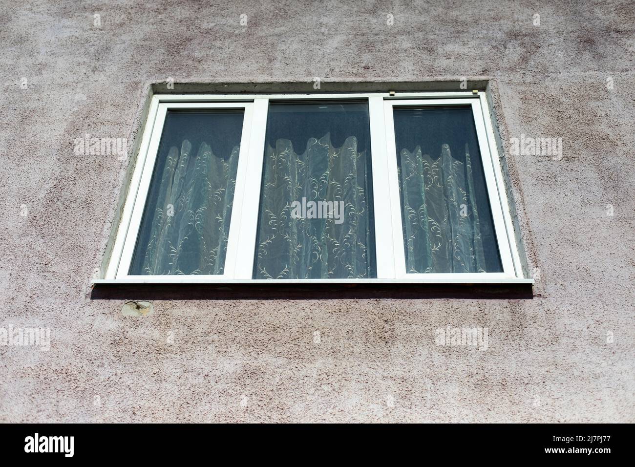 Window in building. Architecture details. White plastic window on ...