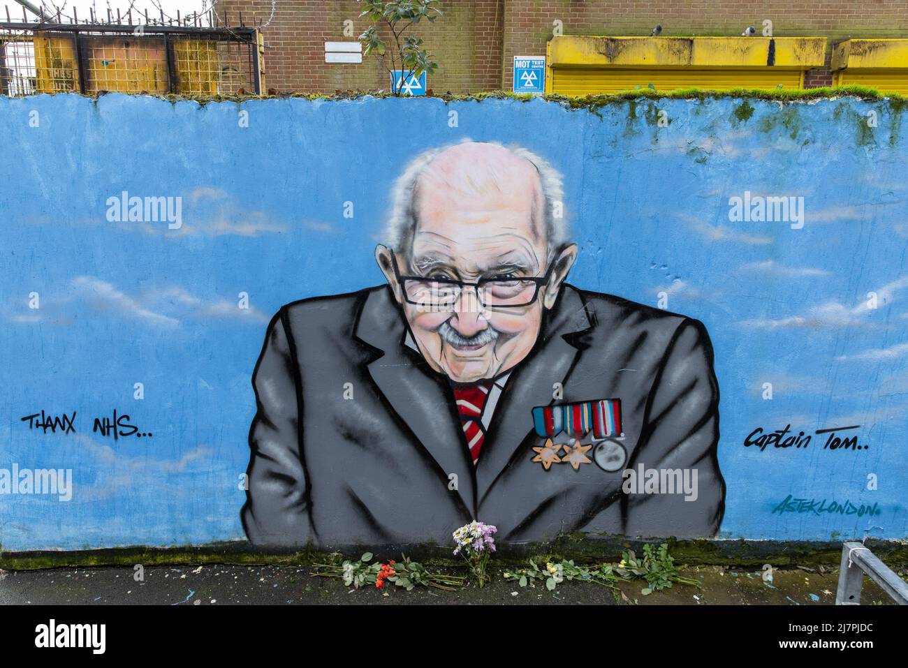 Captain Sir Tom Moore flower tributes left at a mural in Abbey Wood ...