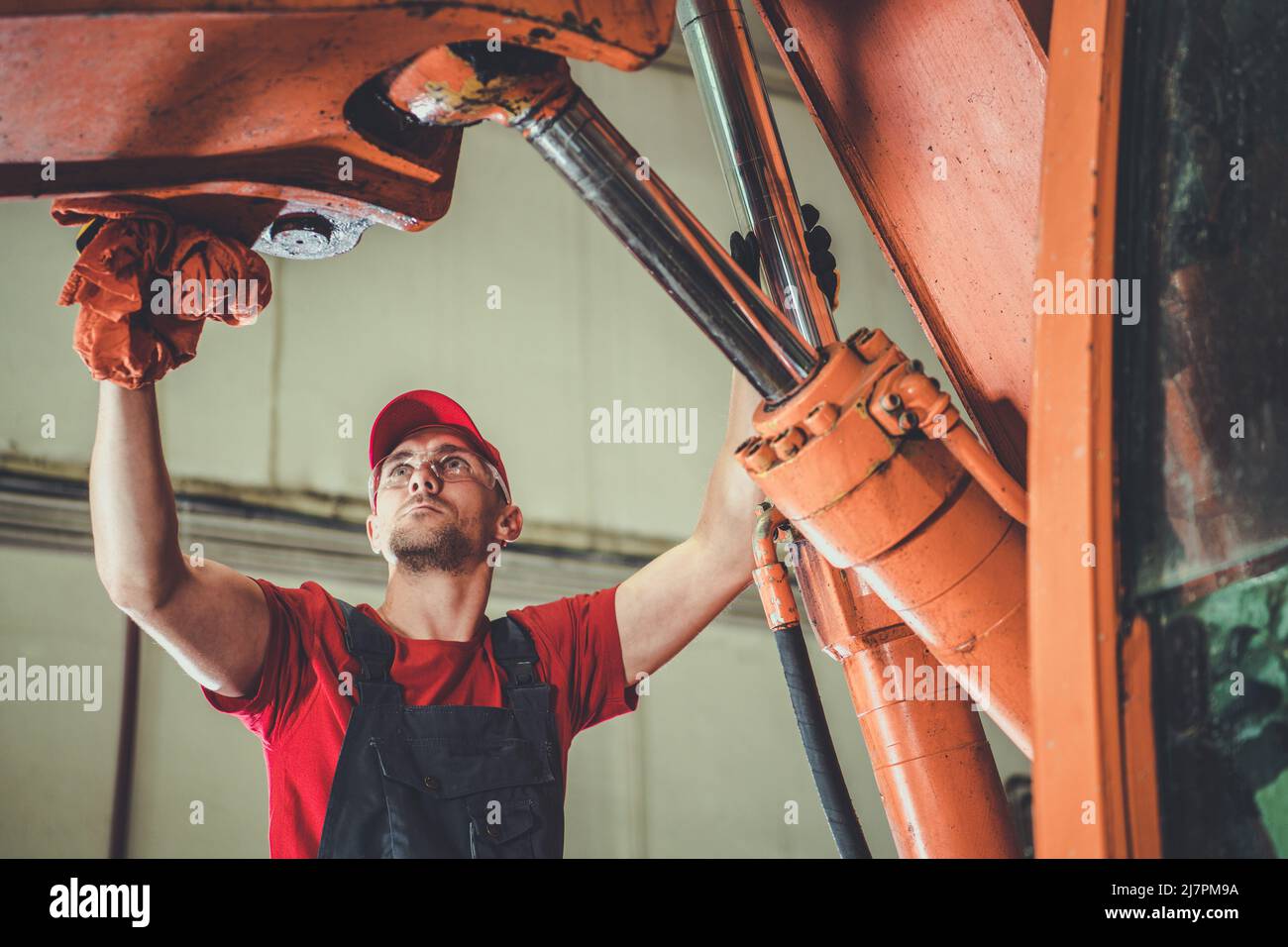 Heavy Equipment Caucasian Mechanic in His 30s Performing Excavator ...