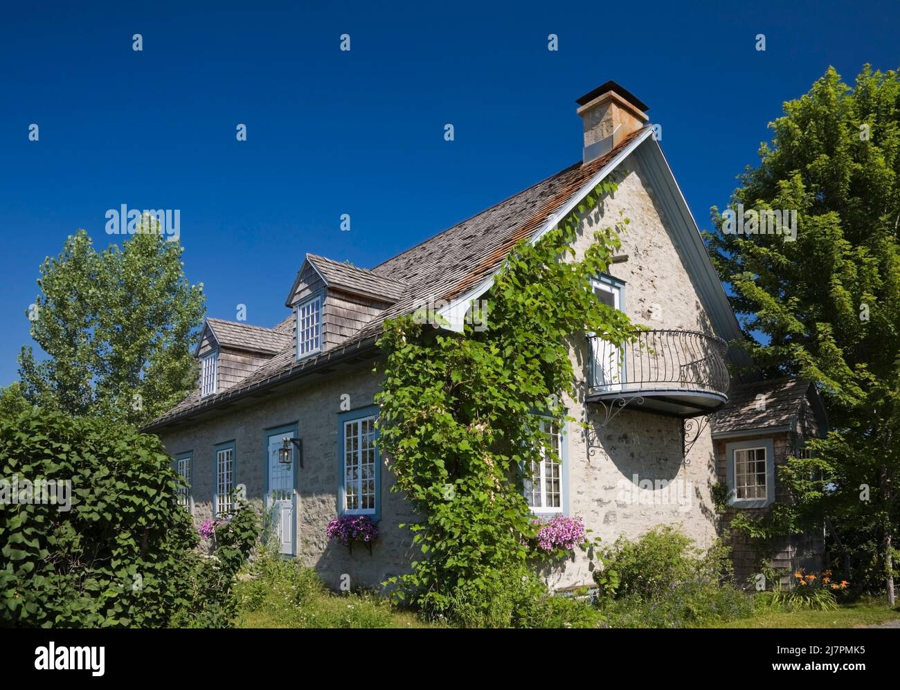 Old circa 1850 Canadiana cottage style fieldstone home with blue and ...