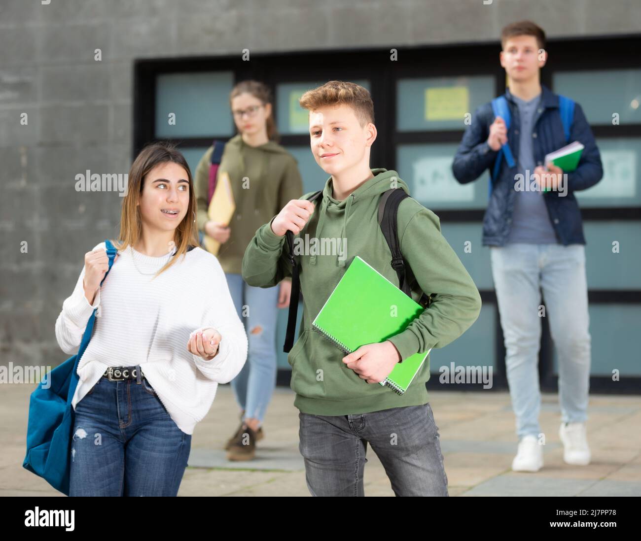 Carefree teen students boy and girl friendly talking Stock Photo - Alamy