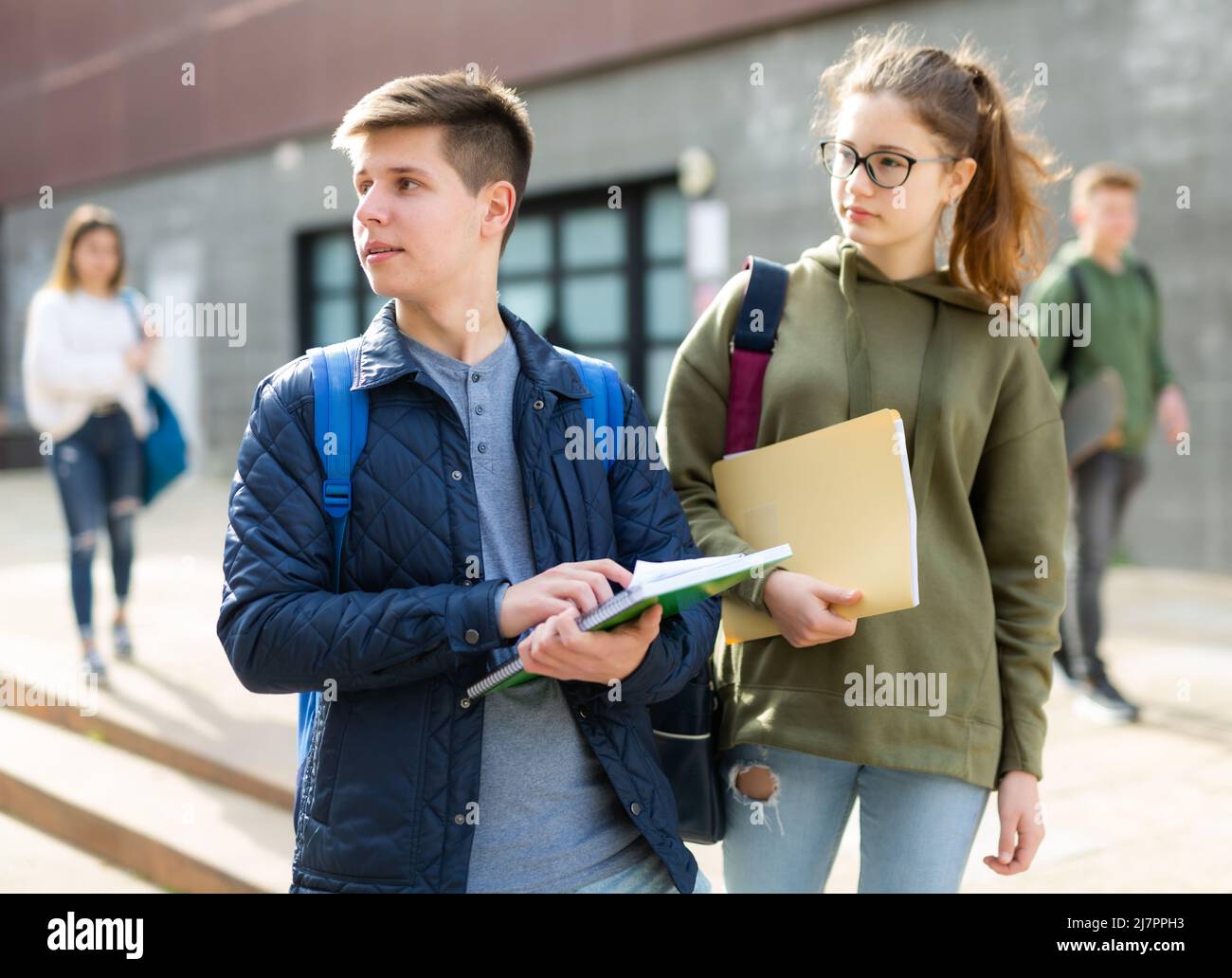 Teenage boy and girl discuss homework Stock Photo - Alamy