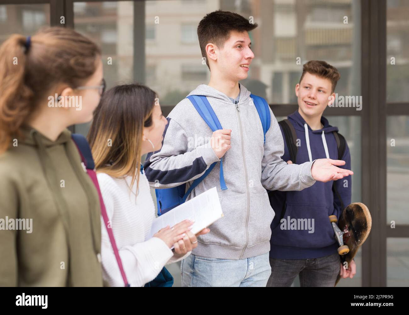 Teenage students talking outside after lessons Stock Photo - Alamy