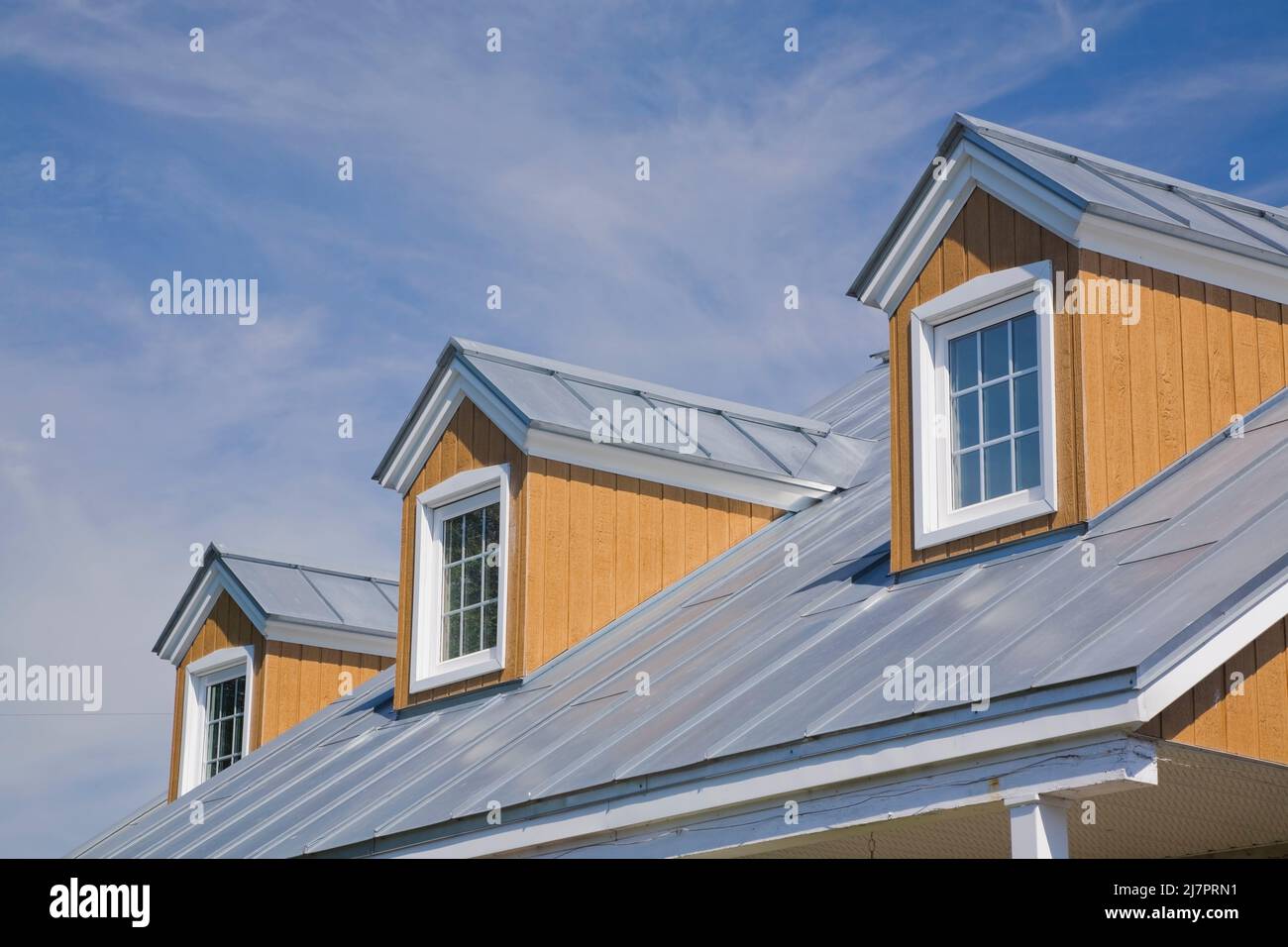 Dormer windows and silver sheet metal roof on replica of old 1800s ...