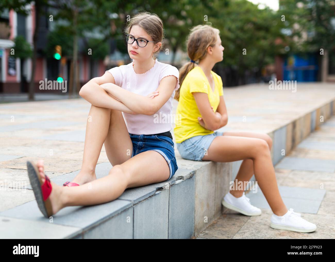 Two teenager girls quarreling in park Stock Photo - Alamy