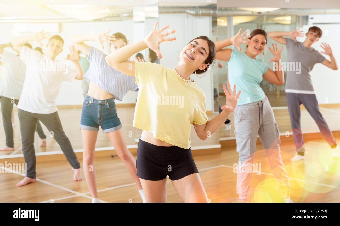Teenagers in dance hall studying new movements Stock Photo - Alamy