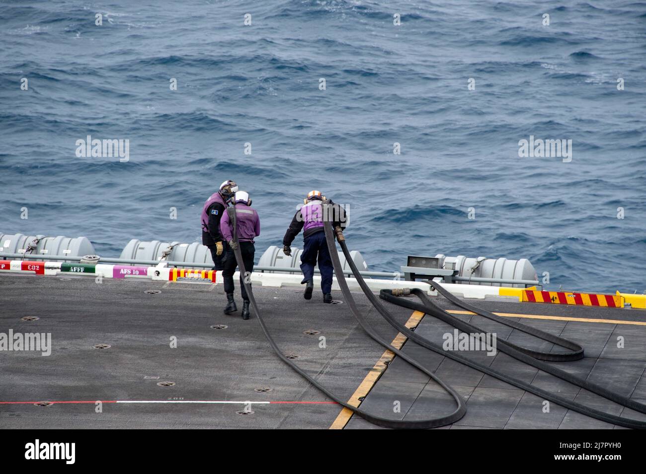 220429-N-TL932-1046 PACIFIC OCEAN (Apr. 29, 2022) Sailors stow a fuel ...