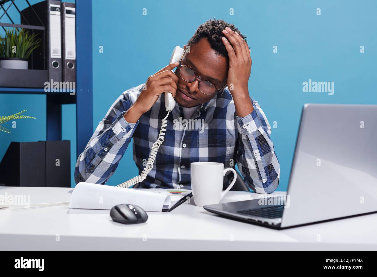 Worried and nervous project manager on phone call with executive ...