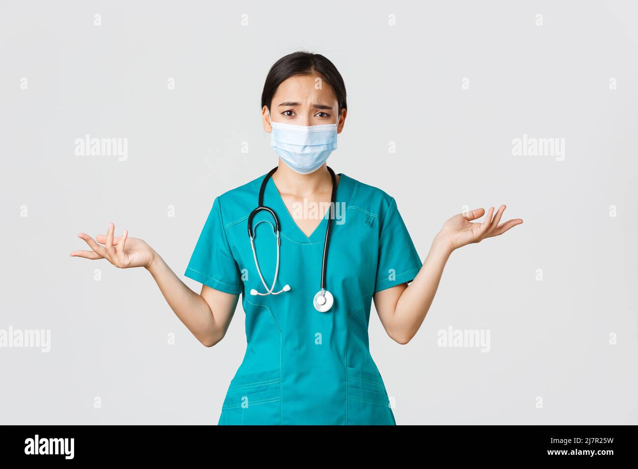 Covid-19, coronavirus disease, healthcare workers concept. Troubled and ...