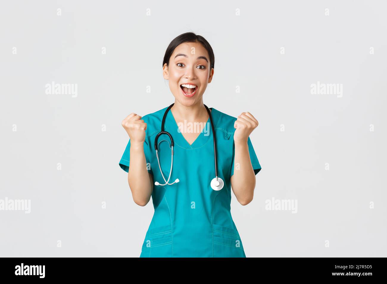 Covid-19, healthcare workers and preventing virus concept. Hopeful and ...