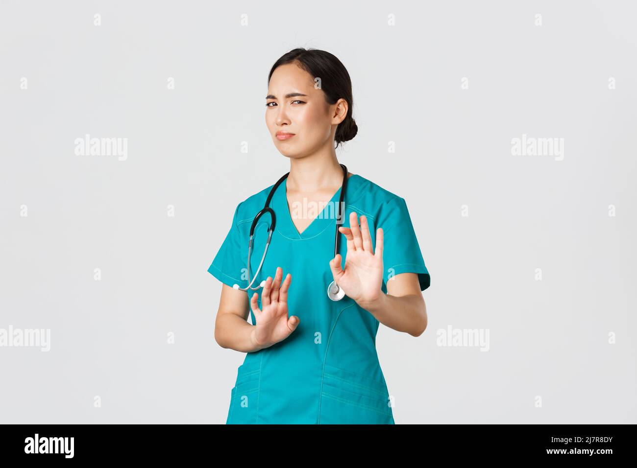 Covid-19, healthcare workers, pandemic concept. Reluctant funny asian ...