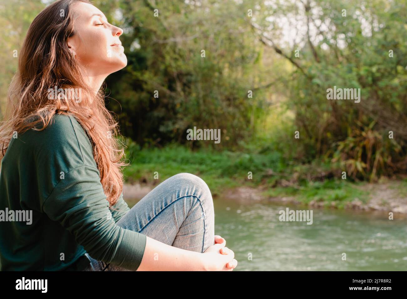 Happy woman enjoying sunlight hi-res stock photography and images - Alamy