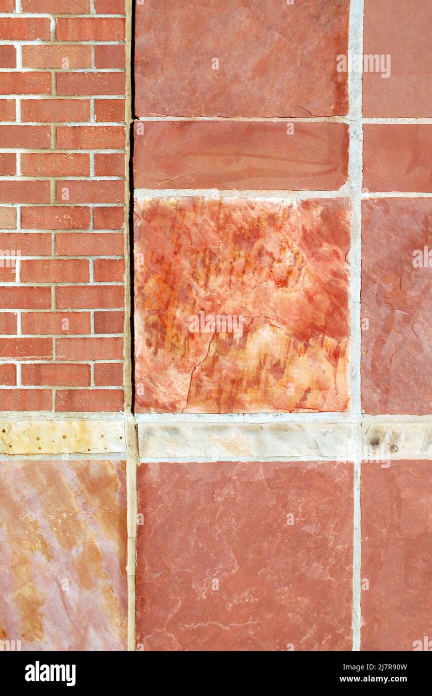 Red sandstone wall background with bricks and larger panels of stone ...