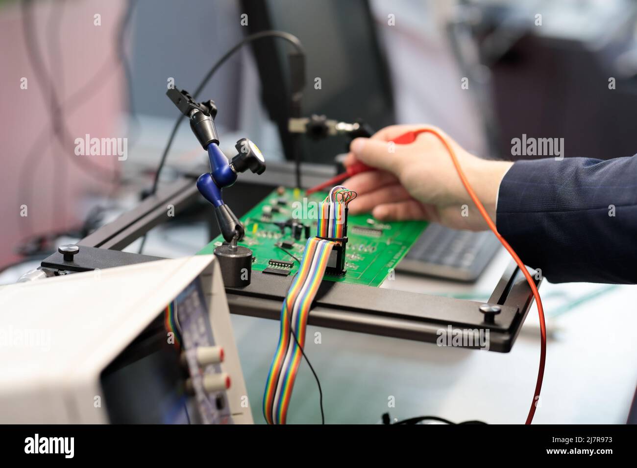 PCB testing and quality control with oscilloscope. Selective focus ...
