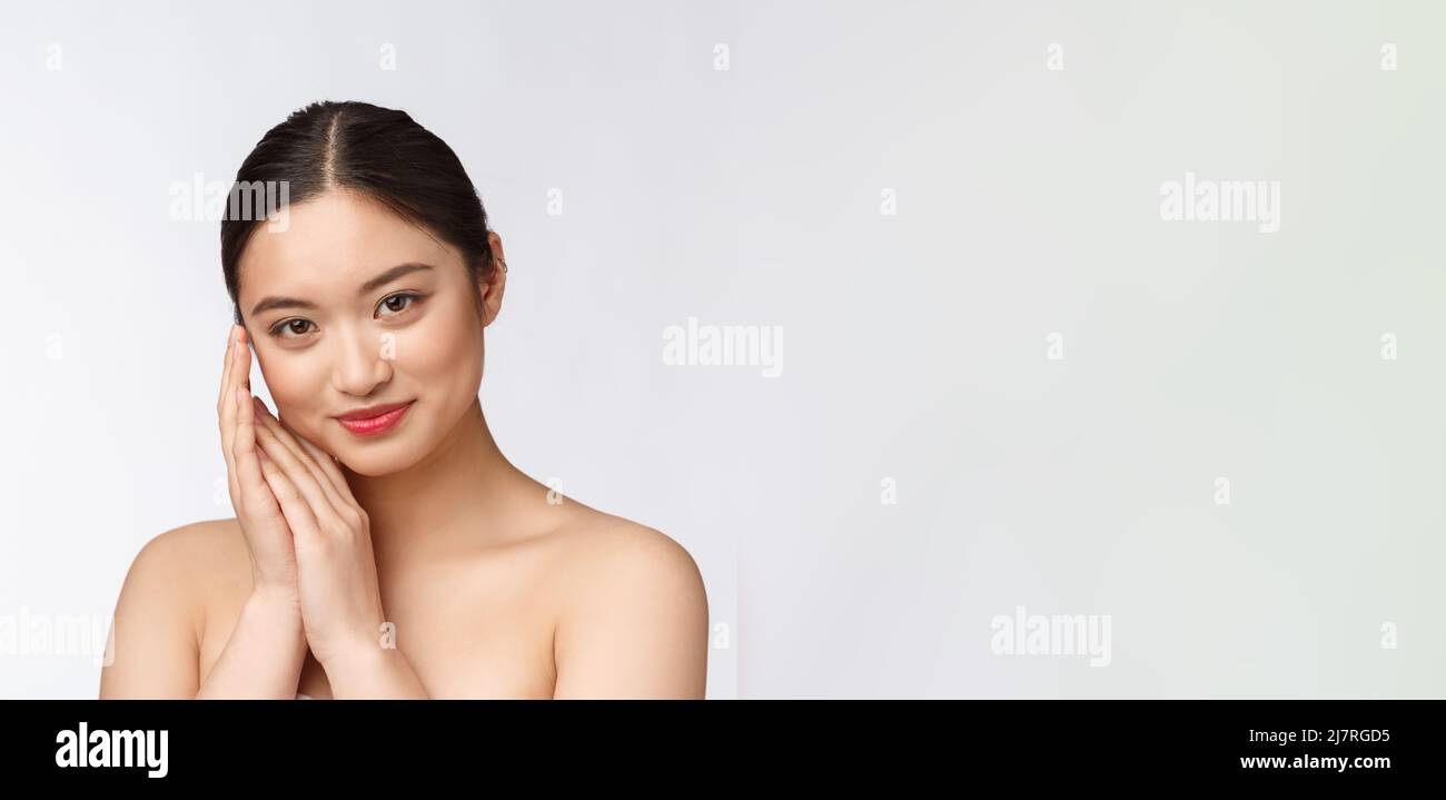 Beautiful asian woman makeup of cosmetic, girl hand touch cheek and ...