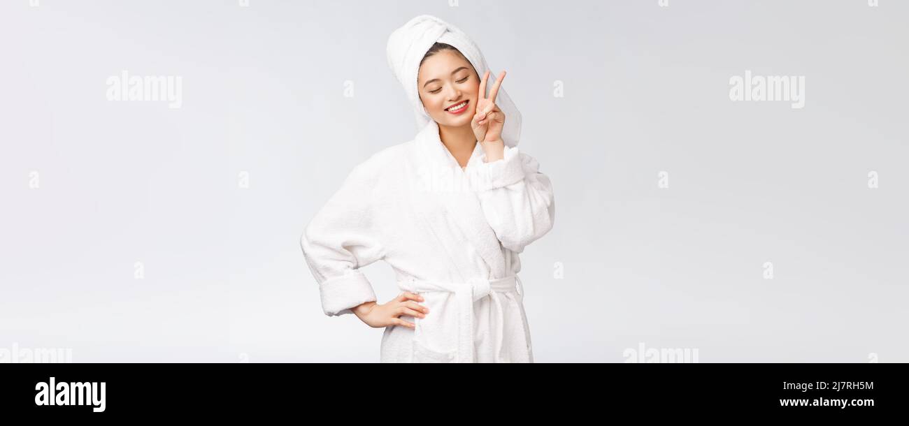 Beautiful asian woman showing peace sign or two finger with happy ...