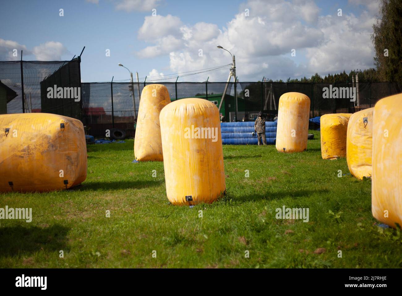 Paint ball court. Sports area of yellow soft objects. Training place ...