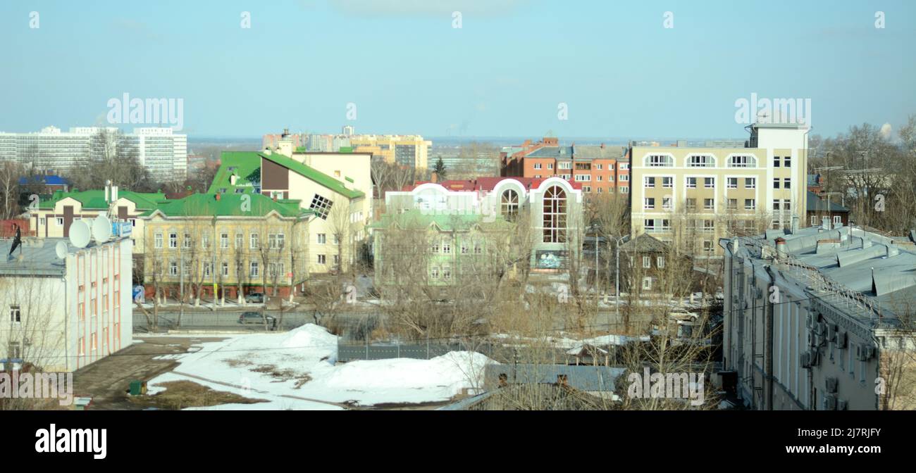 Panoramic view of the buildings and roofs of urban structures in late ...