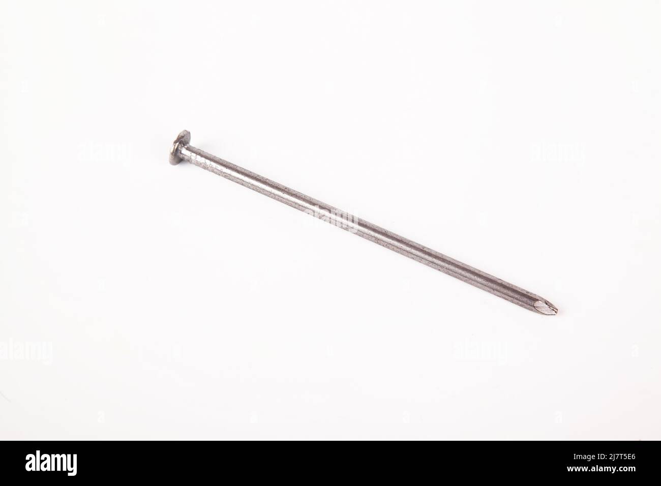 A lot of construction iron nail, industrial parts, isolated on white ...