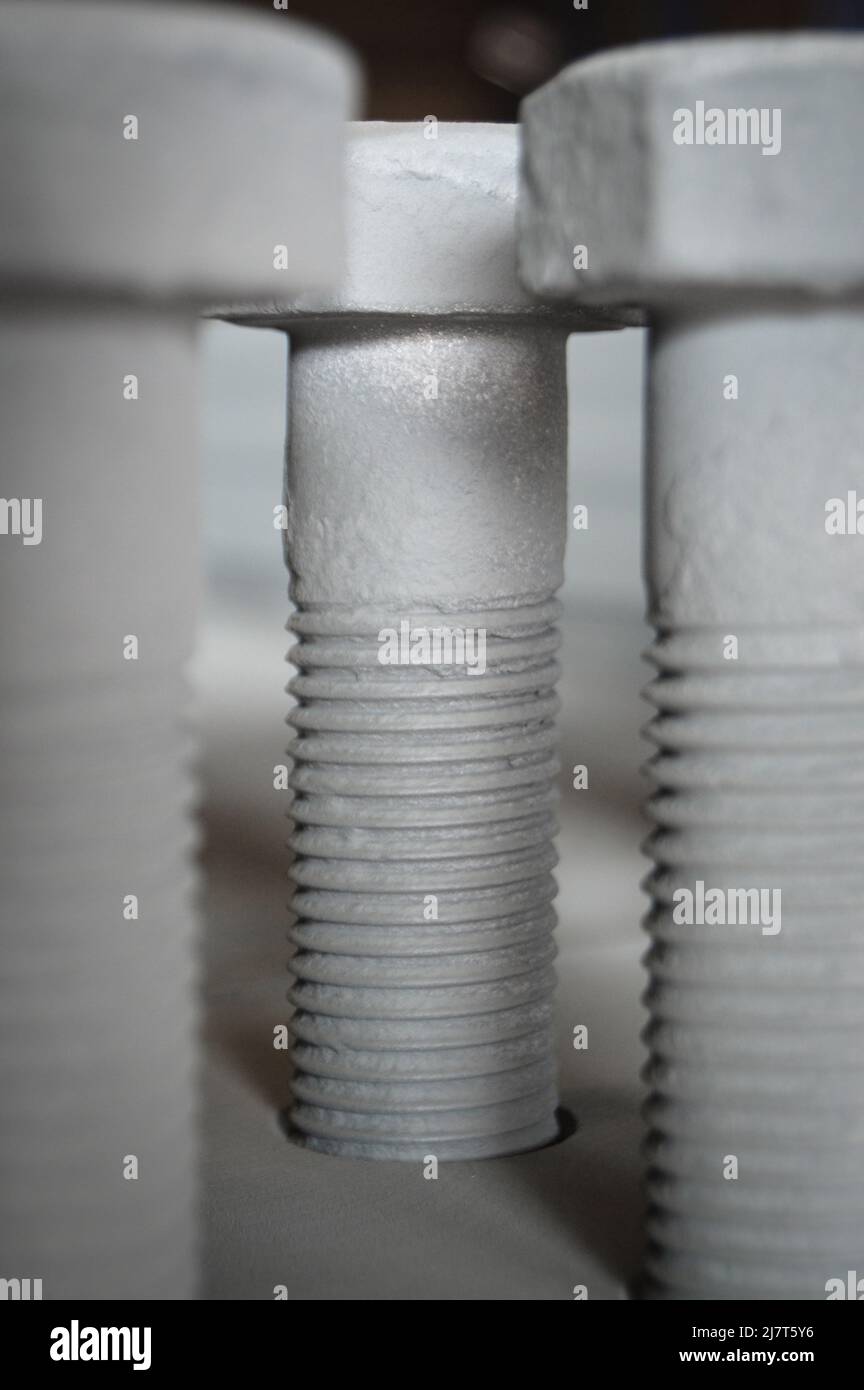 A factory in large bolts and close-up shoot, big gray bolts Stock Photo ...
