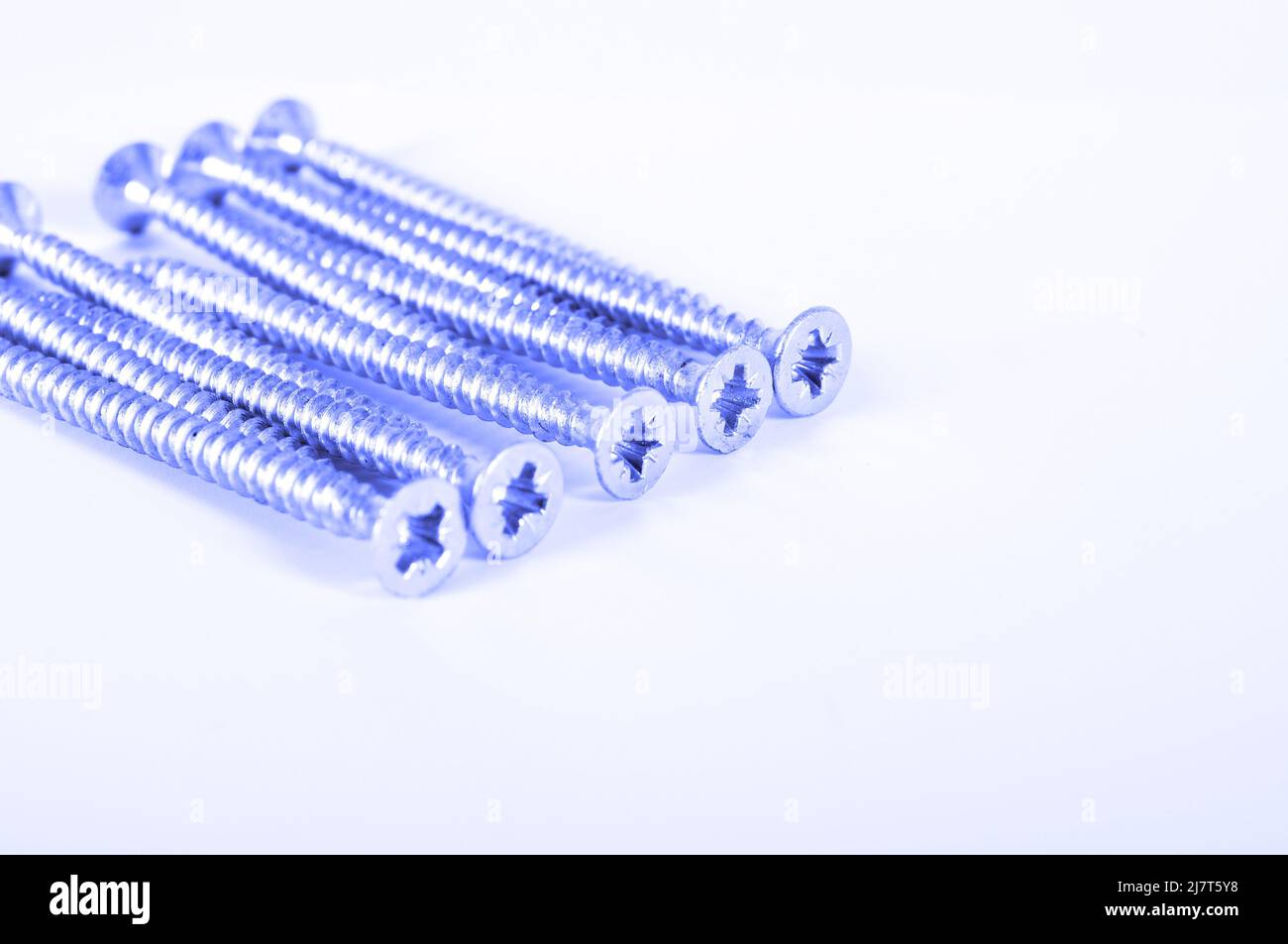 Chrome metal screw and on isolated white background, crosshead screw ...