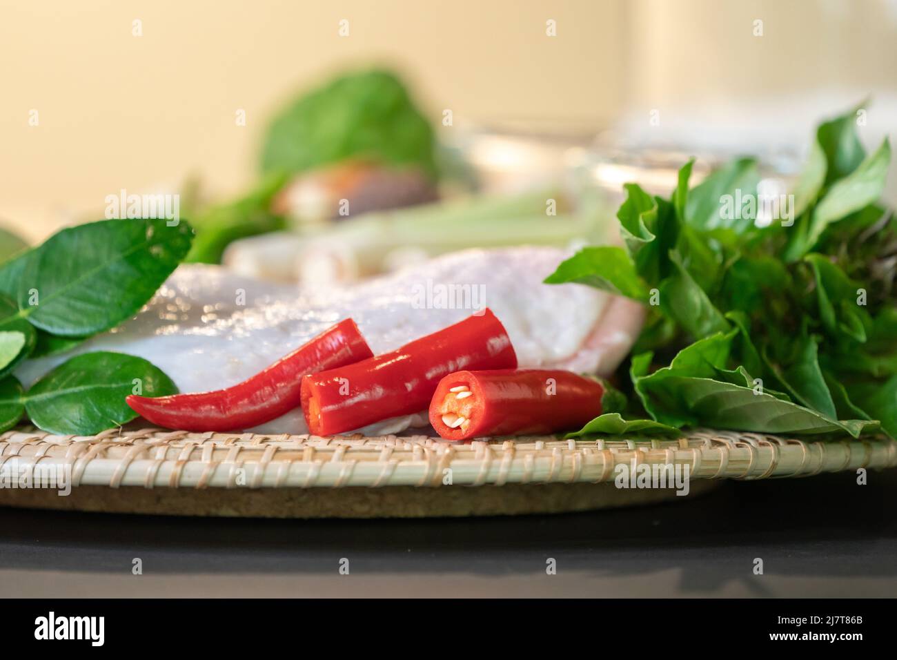 Focusing on finger chillies are placed between basils and green herbs ... Focusing on finger chillies are placed between basils and green herbs ...
