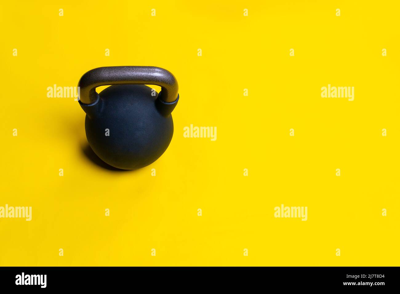 Yellow kettlebell isolated space black ackground fitness object health ...