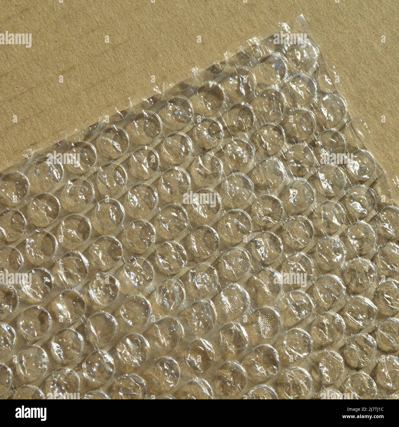 On corrugated cardboard paper plastic air bubble protection foil wrap ...