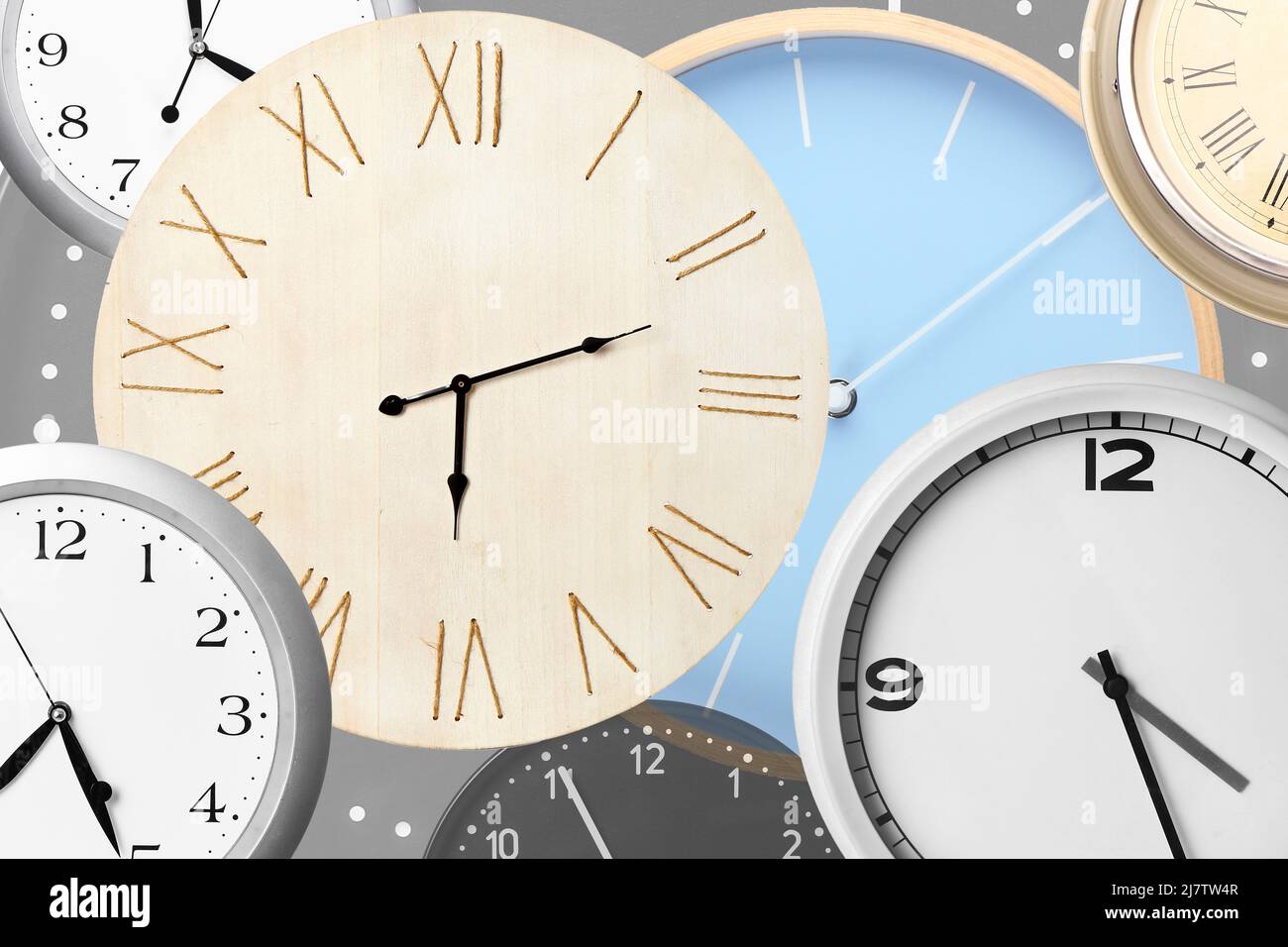 Collage with many different clocks on grey background Stock Photo - Alamy
