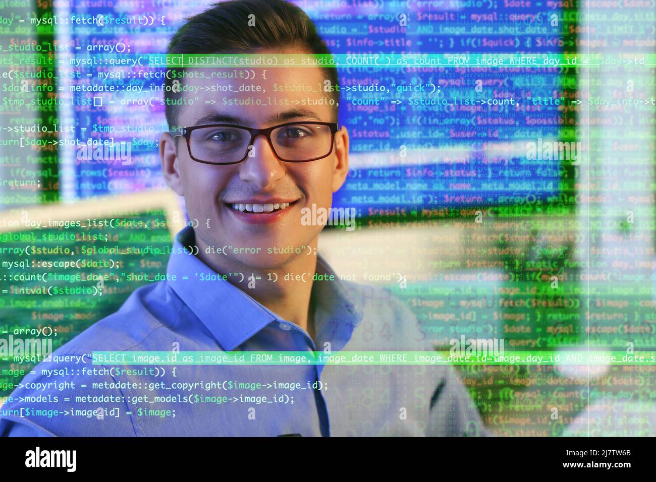 Double exposure of handsome male programmer in office and computer code ...