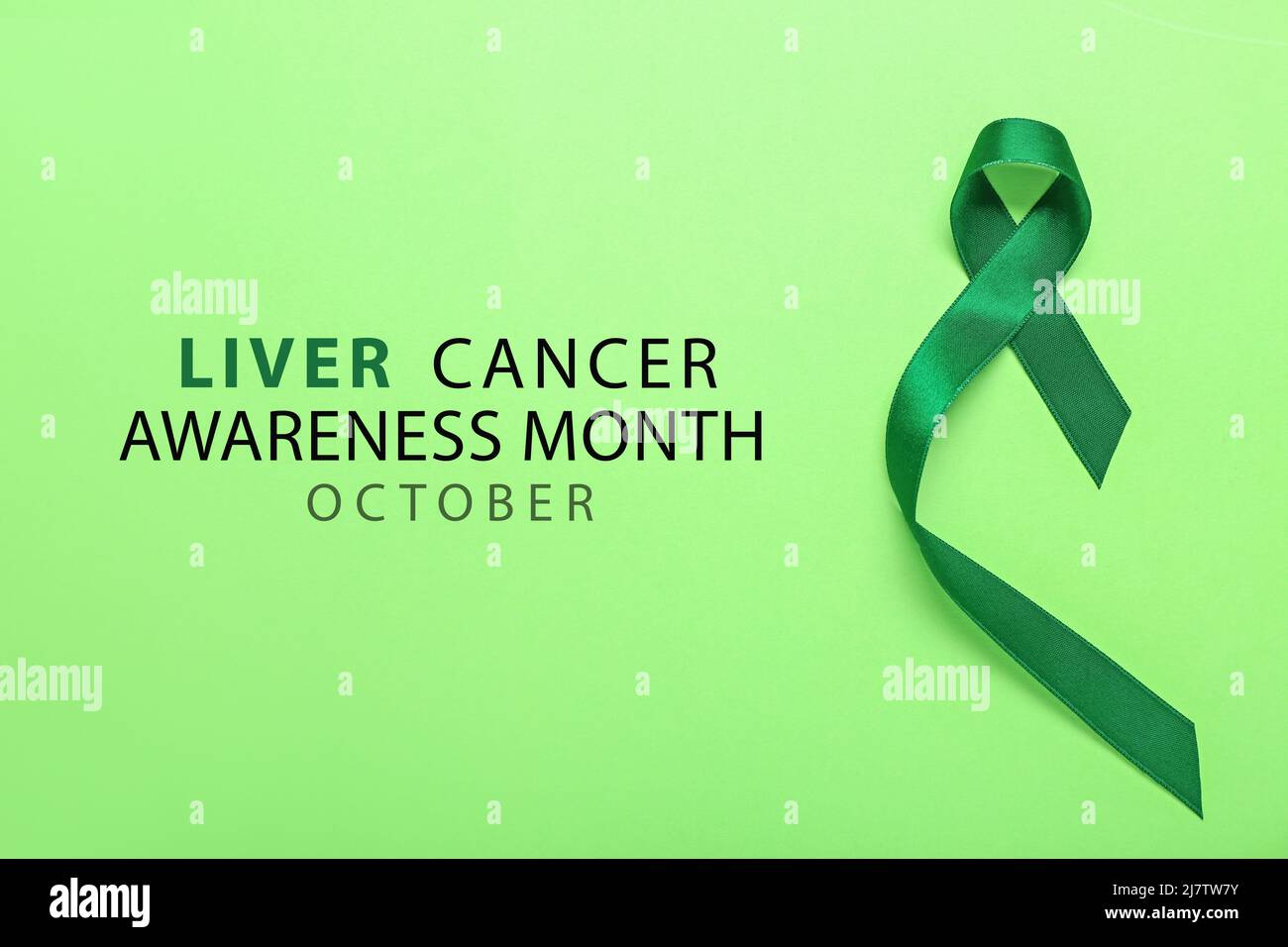 Green ribbon and text LIVER CANCER AWARENESS MONTH - OCTOBER on color ...