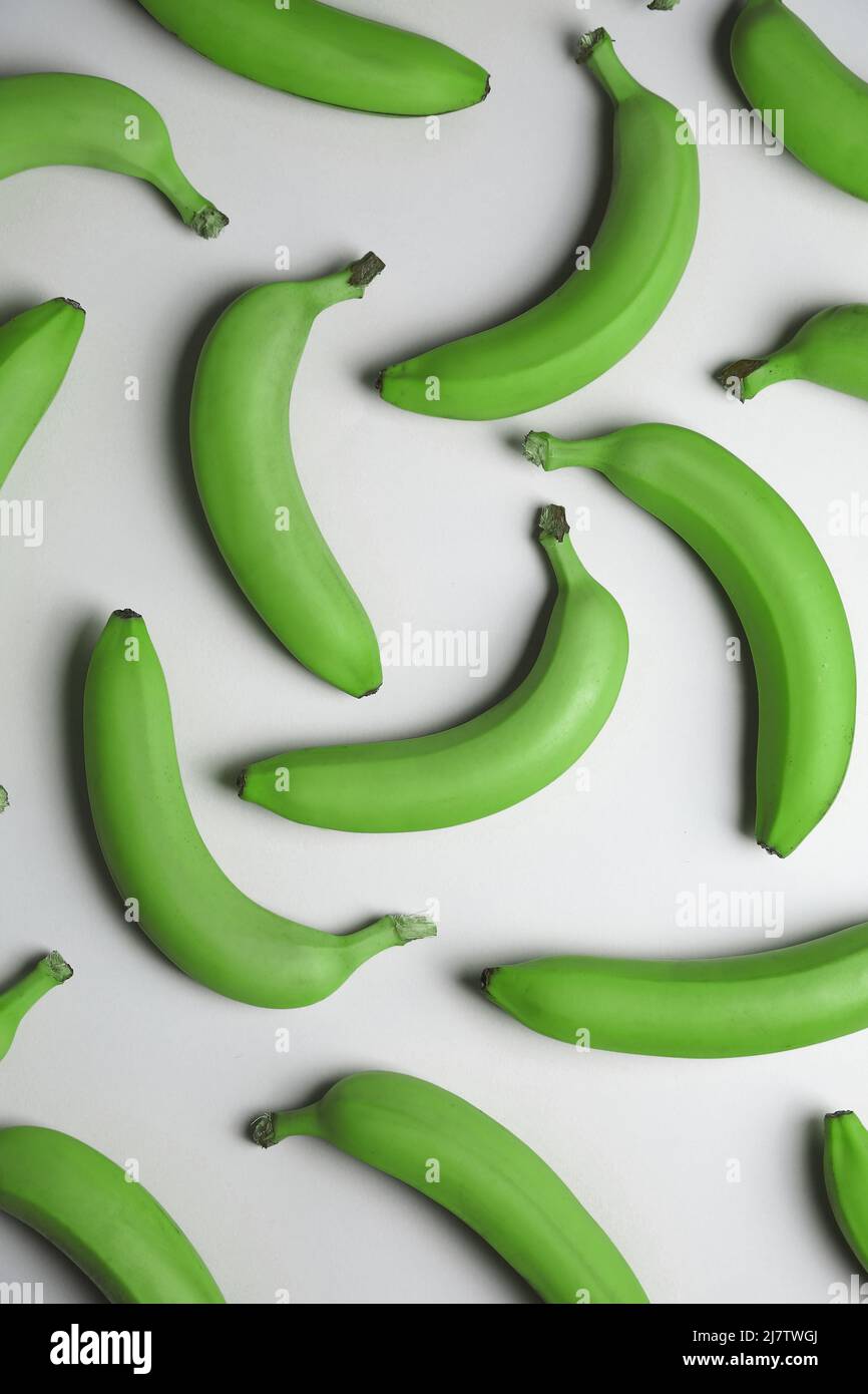 Fresh green bananas on light background Stock Photo - Alamy
