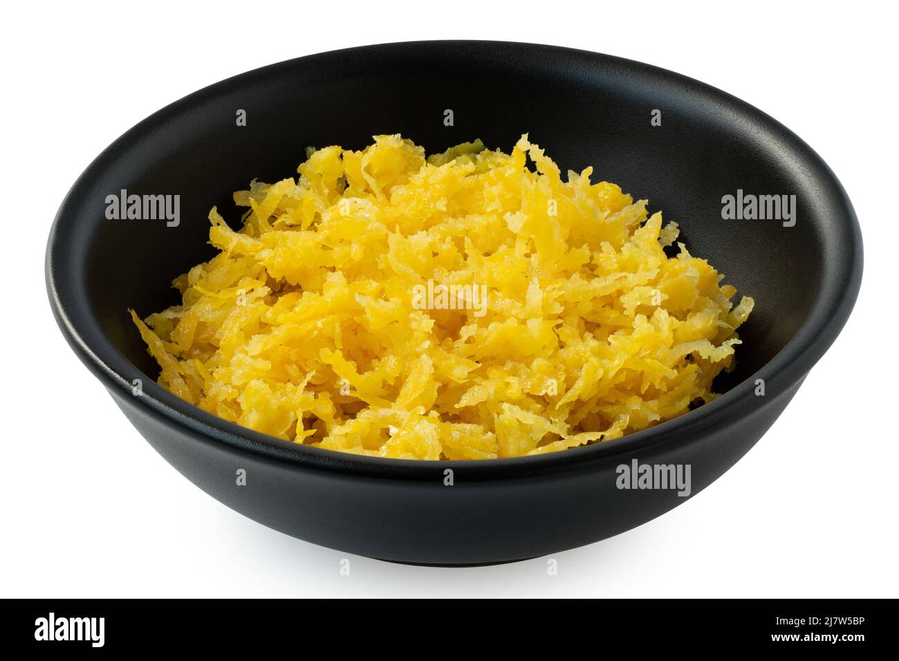 Freshly grated lemon zest in a black ceramic bowl isolated on white ...