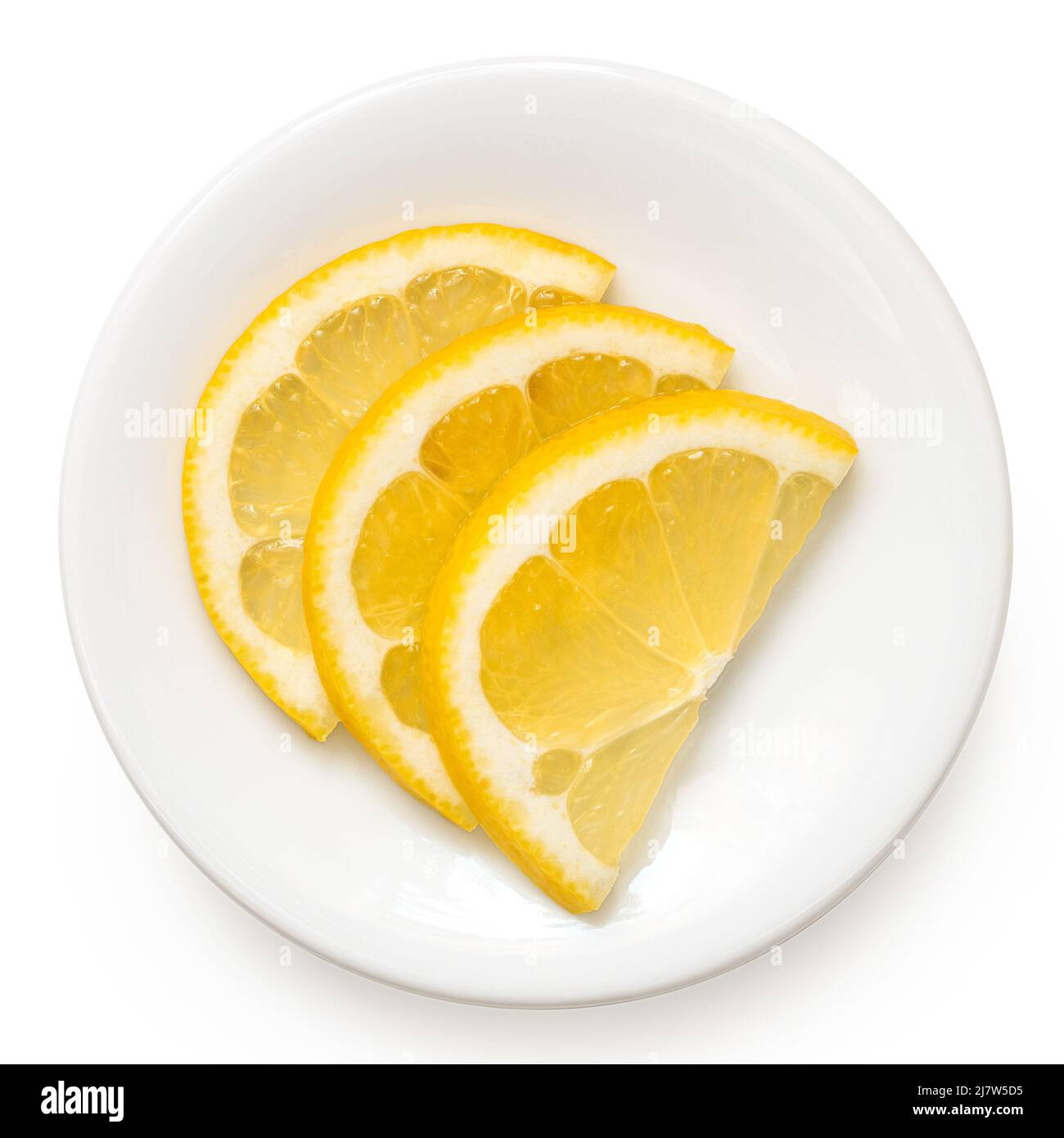 Three half slices of fresh lemon on white ceramic plate isolated on ...