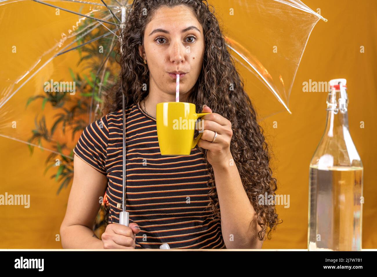Woman drinking water through straw hi-res stock photography and images ...