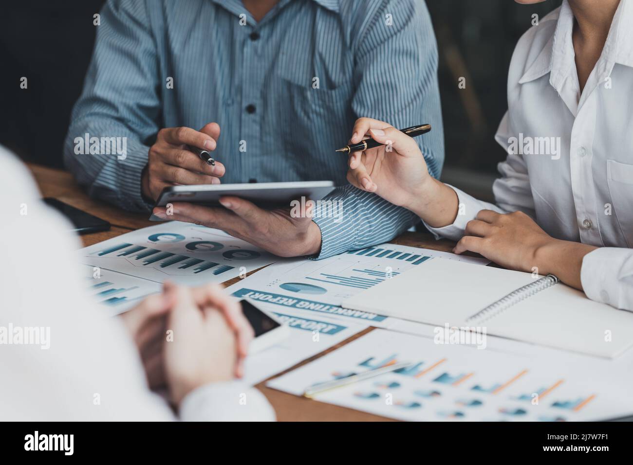 Business team hands at working with financial plan, meeting, discussion ...