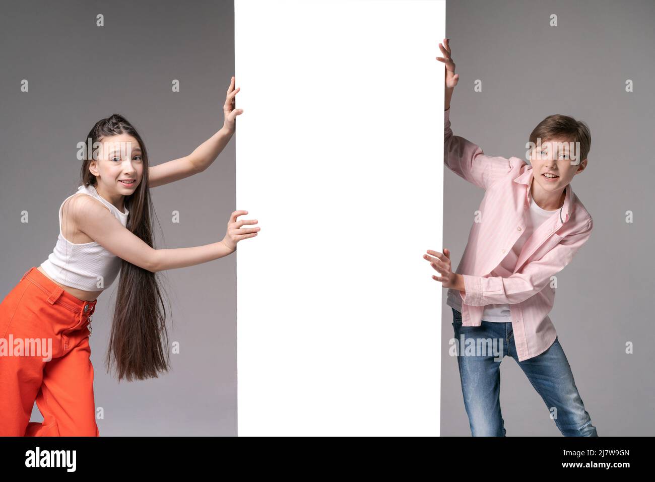 Boy pushing against wall hi-res stock photography and images - Alamy