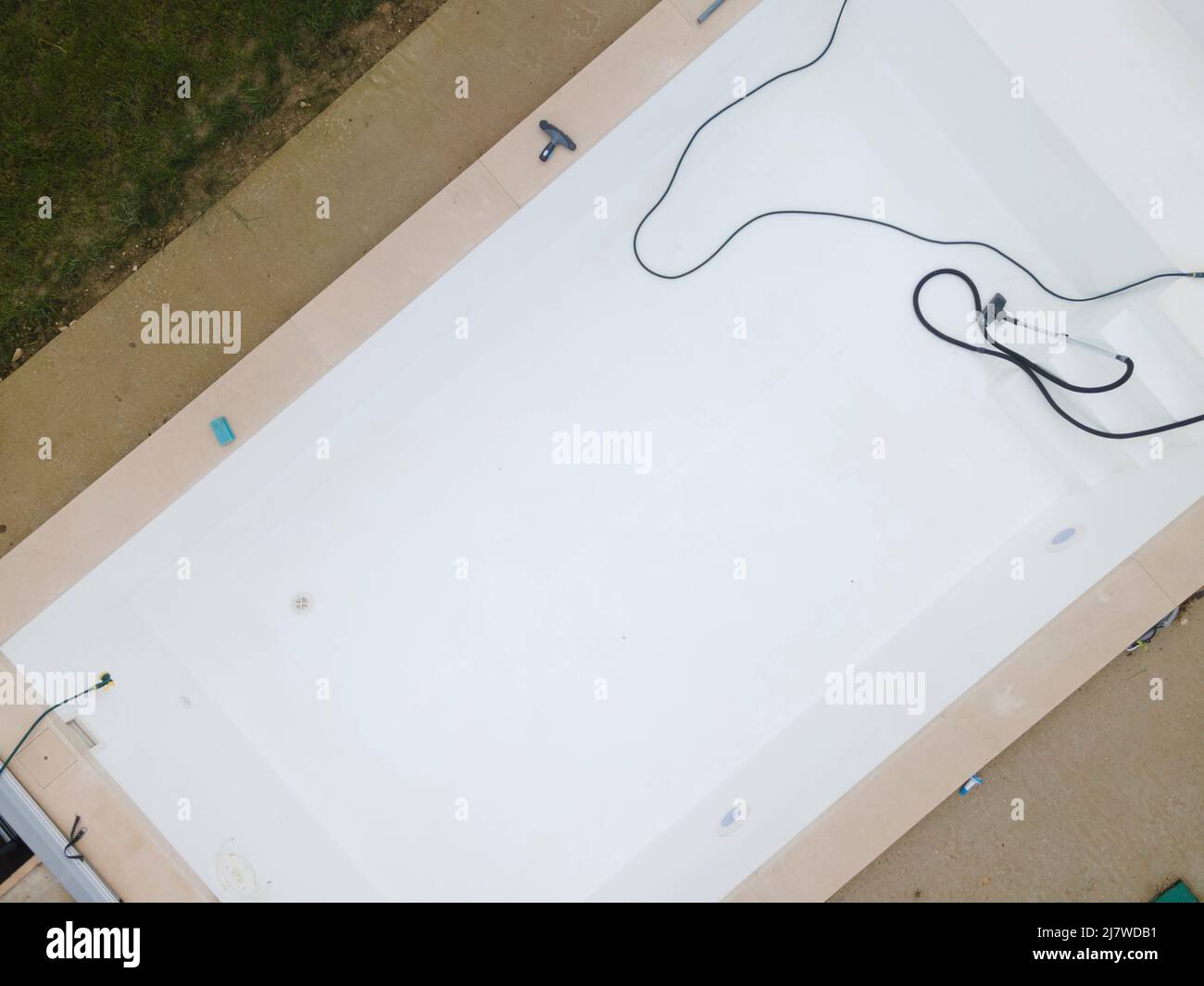 Drone flight over pool in the middle of greenery just left out and ...