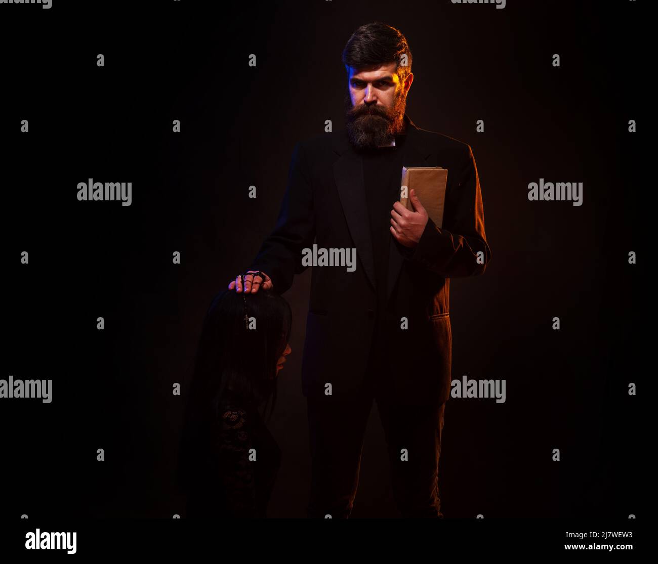 Priest blesses a young woman. Religion holy. Priest sin. Church Pastor ...