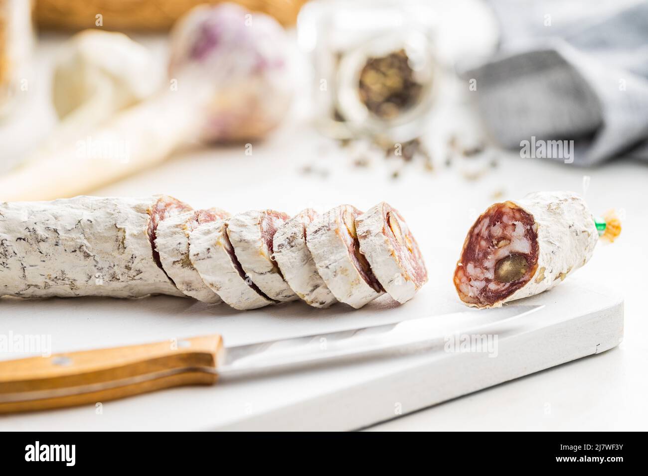 Traditional sausage with white mold. Dried sliced pork salami on a ...