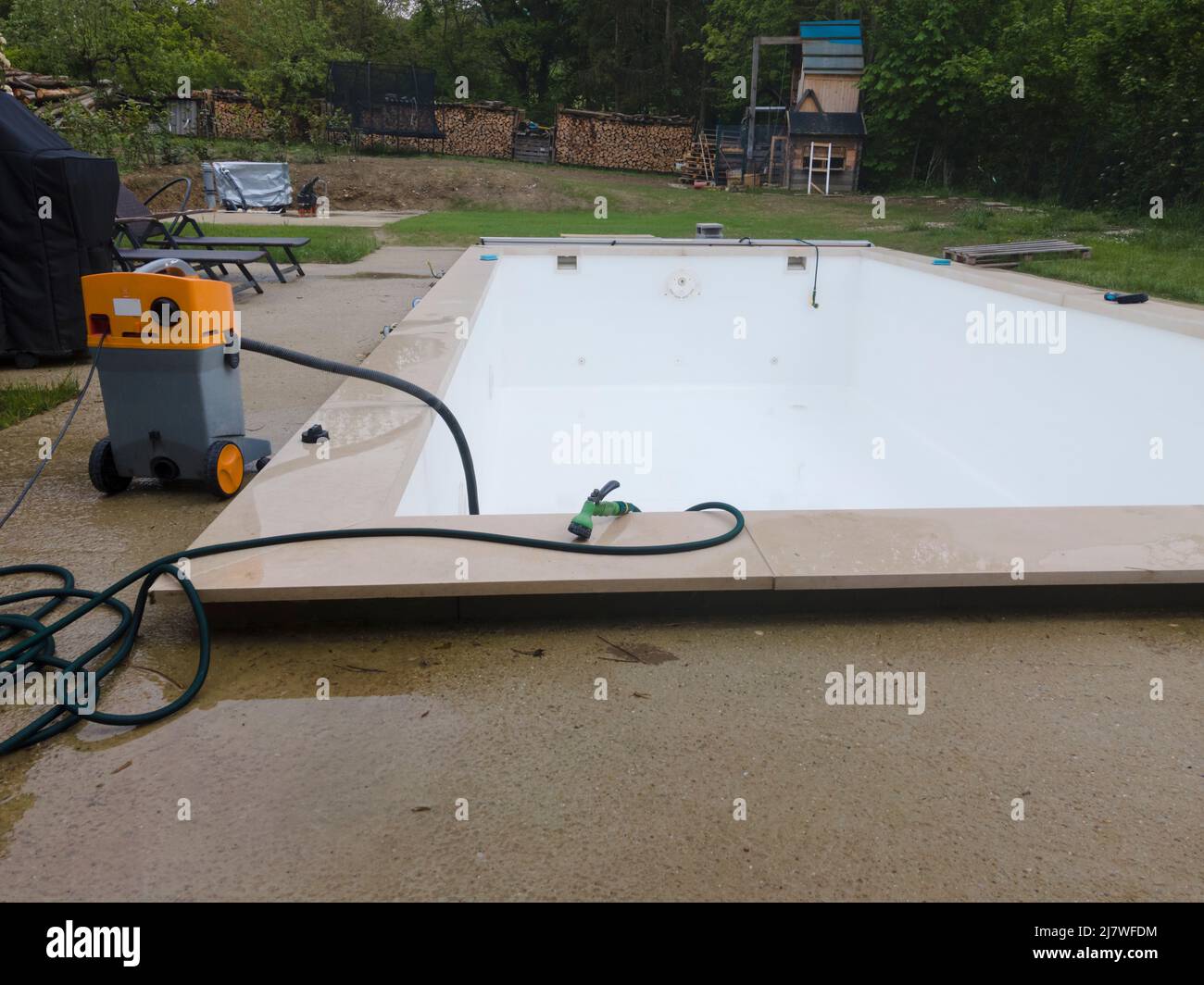 Drone flight over pool in the middle of greenery just left out and ...
