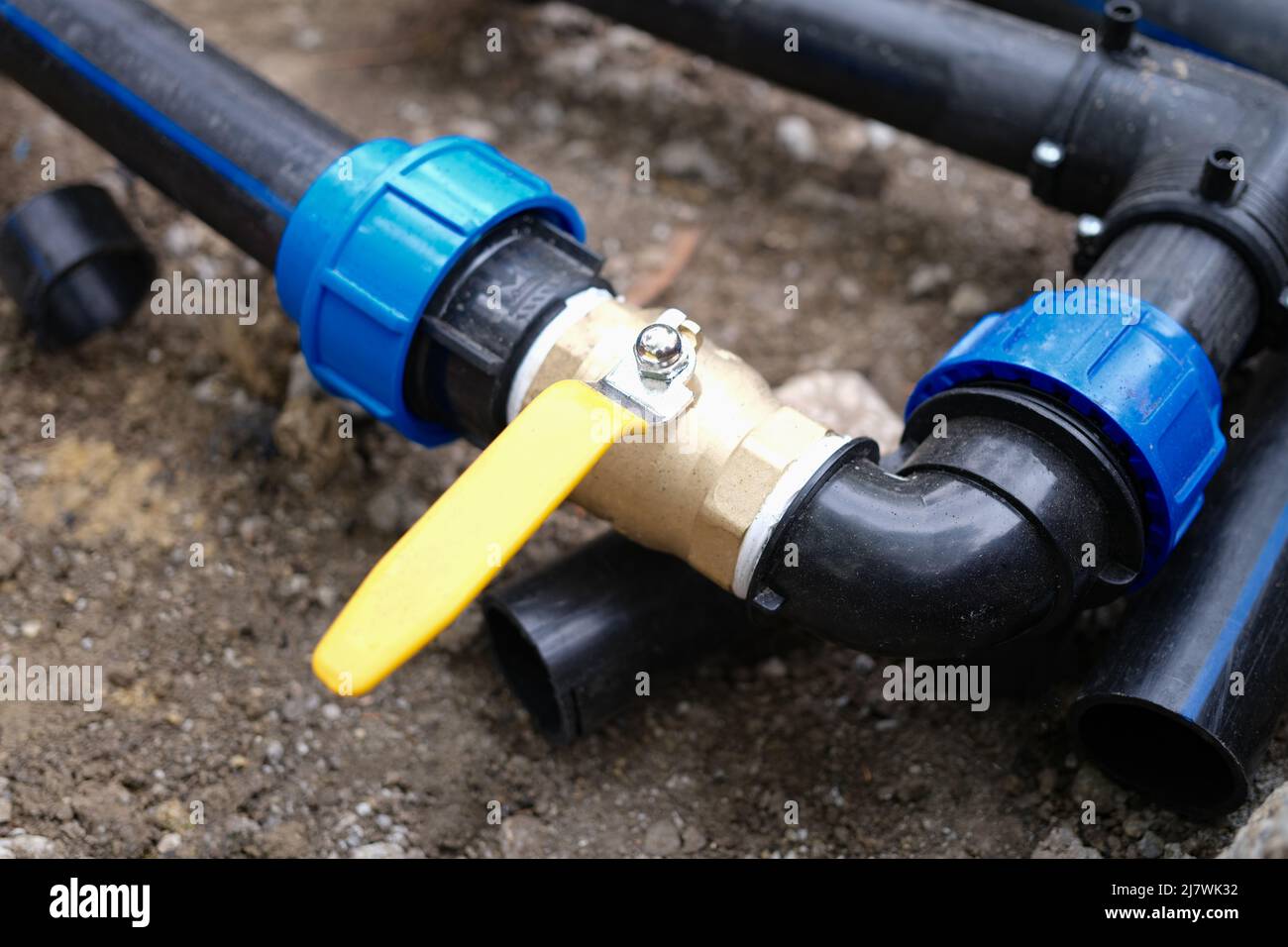 Water pipe connector with faucet closeup for watering plants in garden ...