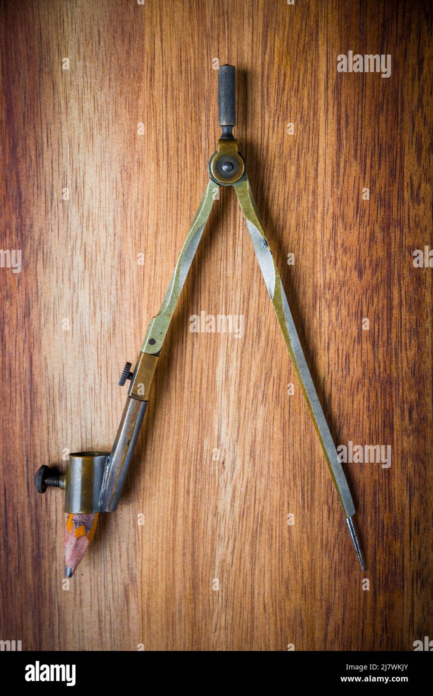 Old vintage pair of compasses on a wooden table background Stock Photo ...