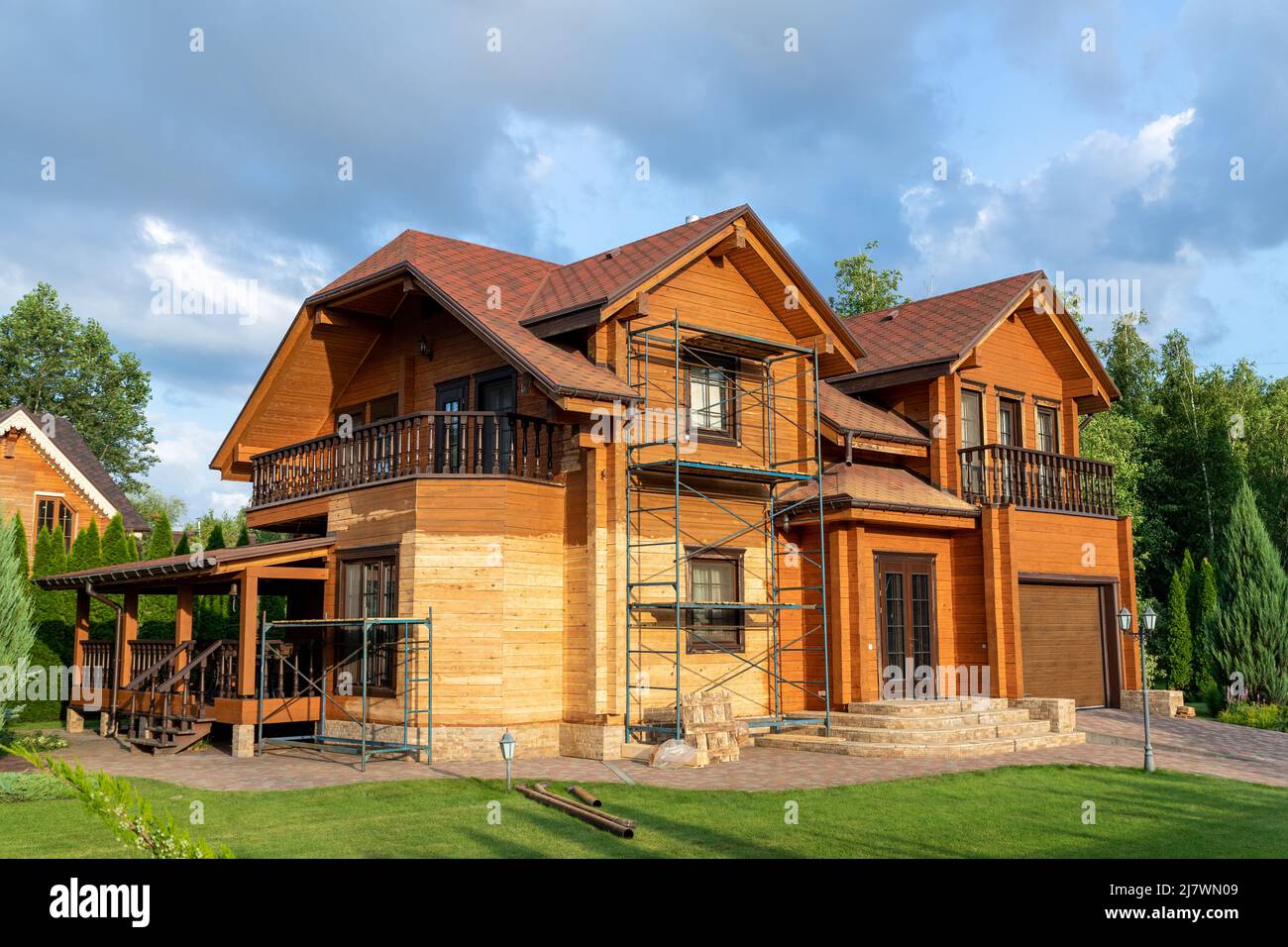 Modern wooden timber eco house villa facade during process of ...