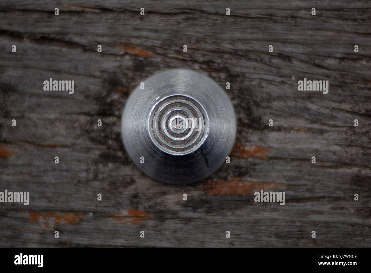 Circular rivets in wood deck Stock Photo - Alamy