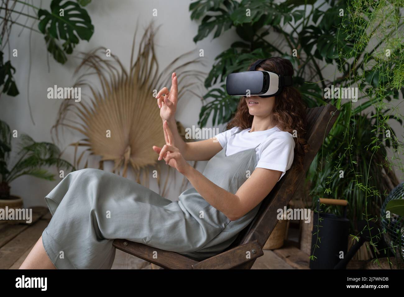 Happy girl in vr glasses touch interactive screen virtual reality for ...