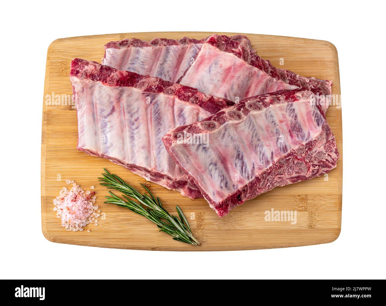 Raw pork ribs. Arrangement on cutting board. Fresh raw pork ribs with ...