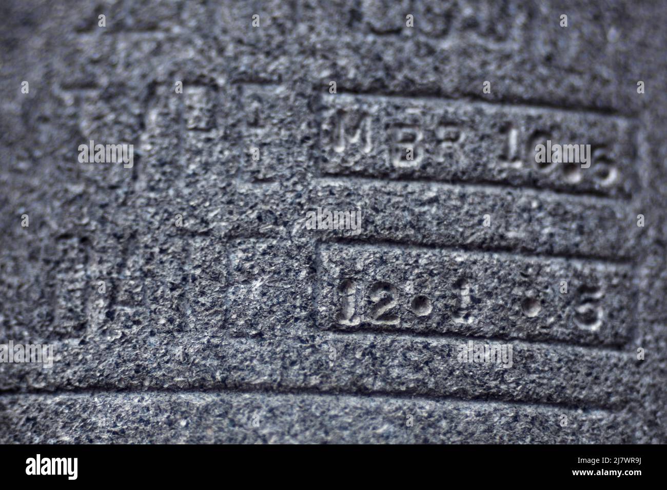 Stone with letters and numbers Stock Photo - Alamy